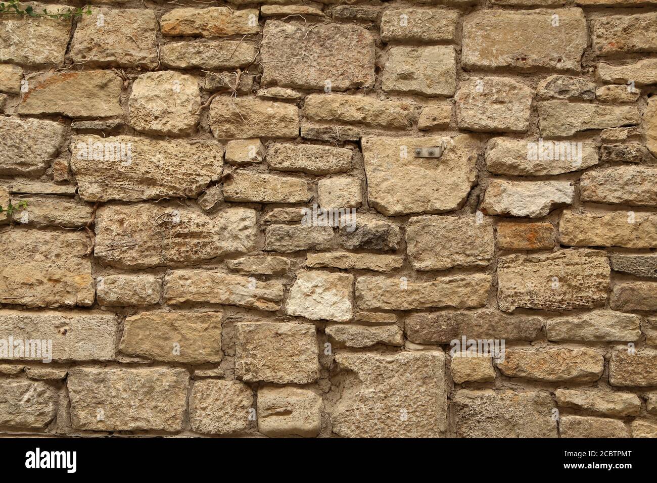 Gray stone wall made of natural stone Stock Photo - Alamy