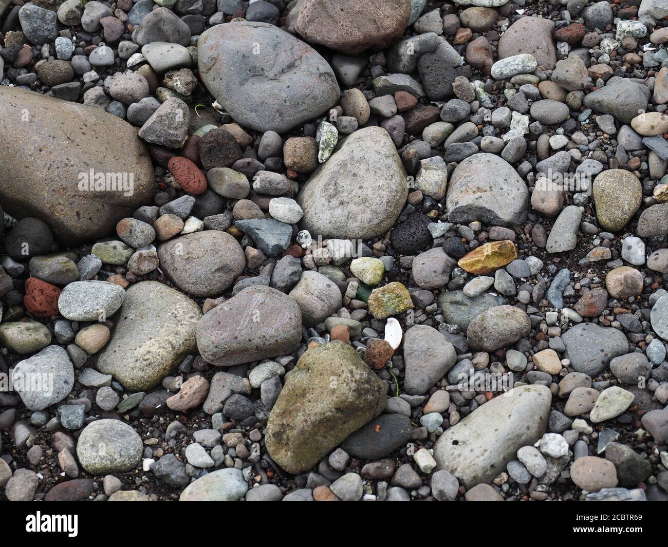 High angle shot of big and small pebble stones on the seashore Stock ...