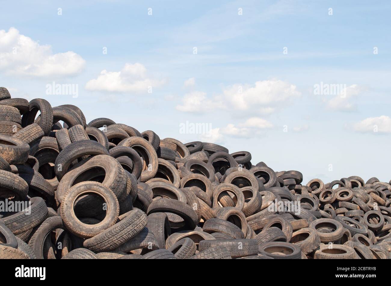 Old car tires for recycling Stock Photo - Alamy