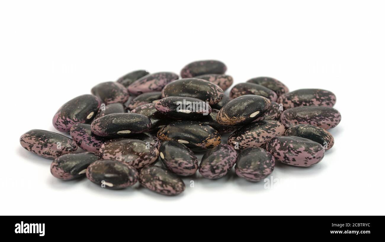 Seeds of fire beans against white background Stock Photo - Alamy