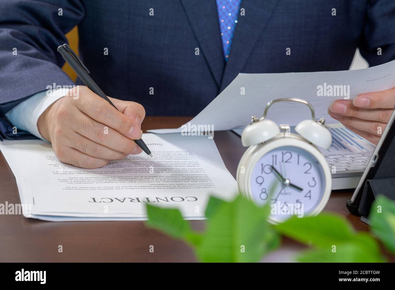 Working Businessman and White Alarm Clock. Work Time concept Stock ...