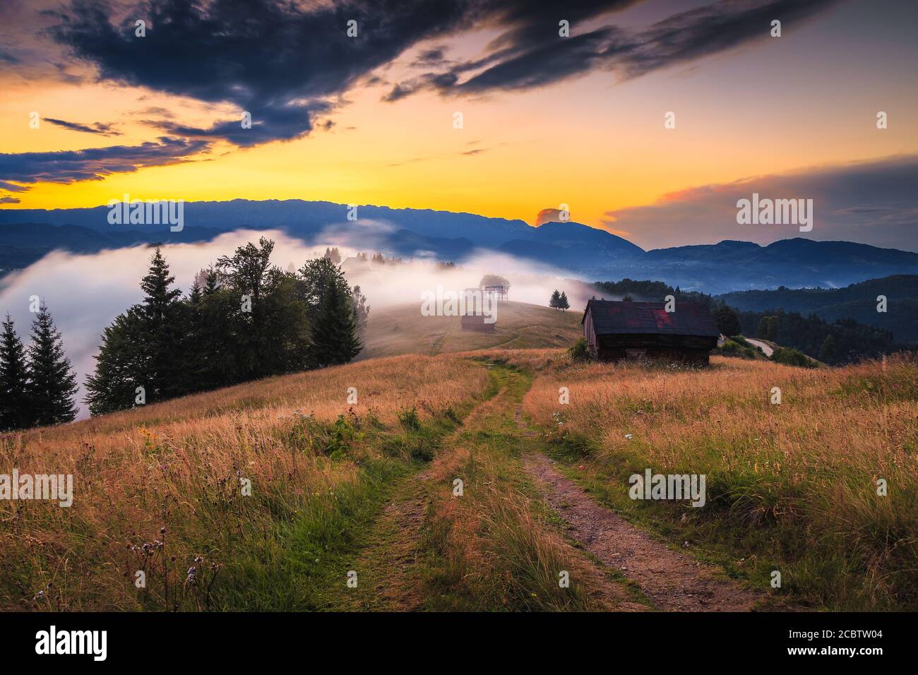 Amazing autumn countryside landscape with misty hills at sunset ...