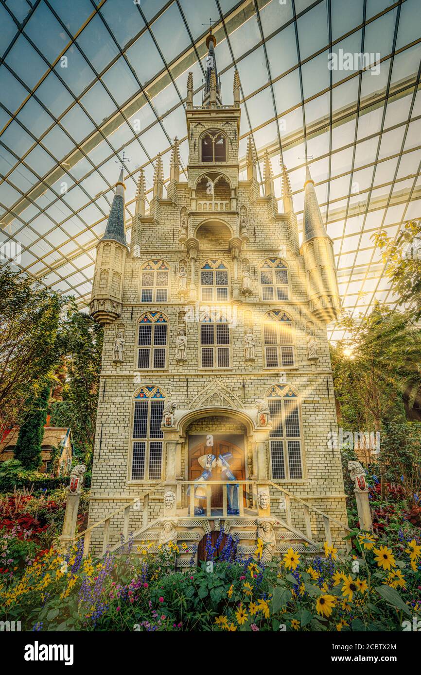 European church facade among flowers and fauna inside the flower dome ...