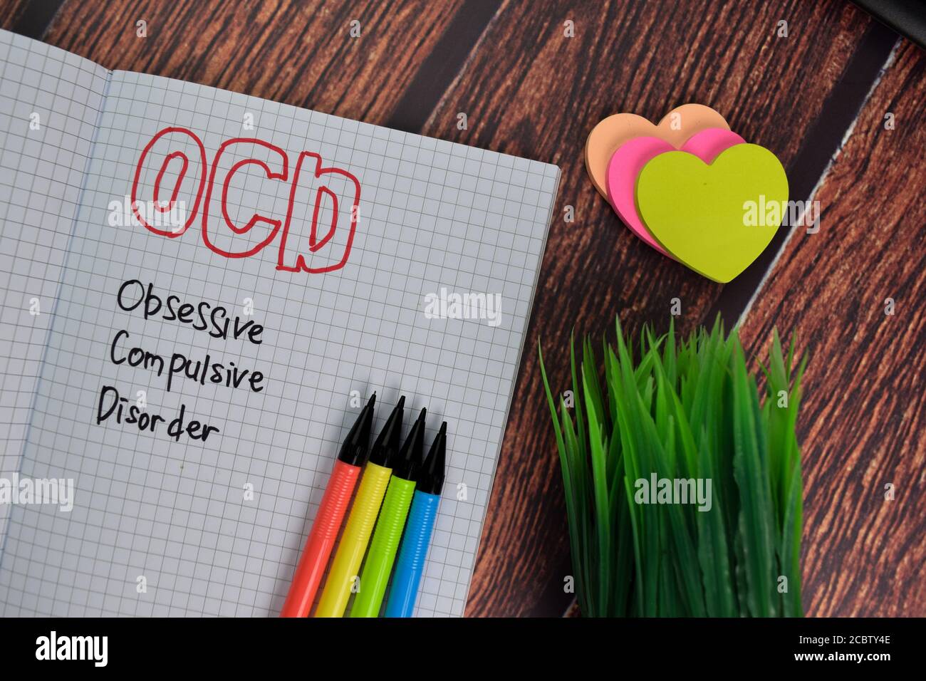 OCD - Obsessive Compulsive Disorder write on a book isolated on office ...