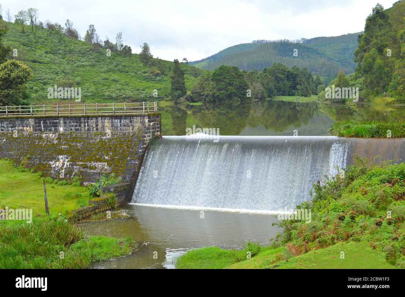 scenic photo of a historic checkdam in the Nilgiris shows overflowing ...