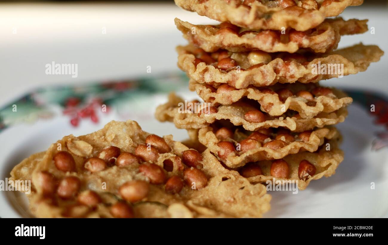 Peanut Peyek on plate. Peanut Rempeyek or Peyek is a deep-fried savoury ...
