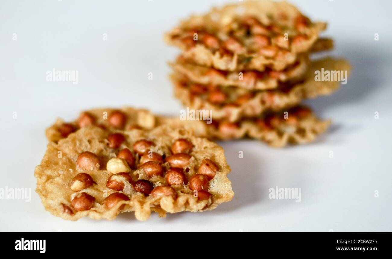 Peanut Peyek on white background. Peanut Rempeyek or Peyek is a deep ...