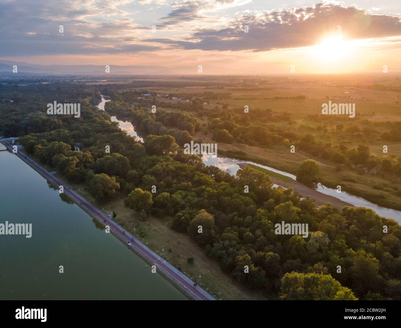Aerial sunset view of Maritsa River passing near the city of Plovdiv ...