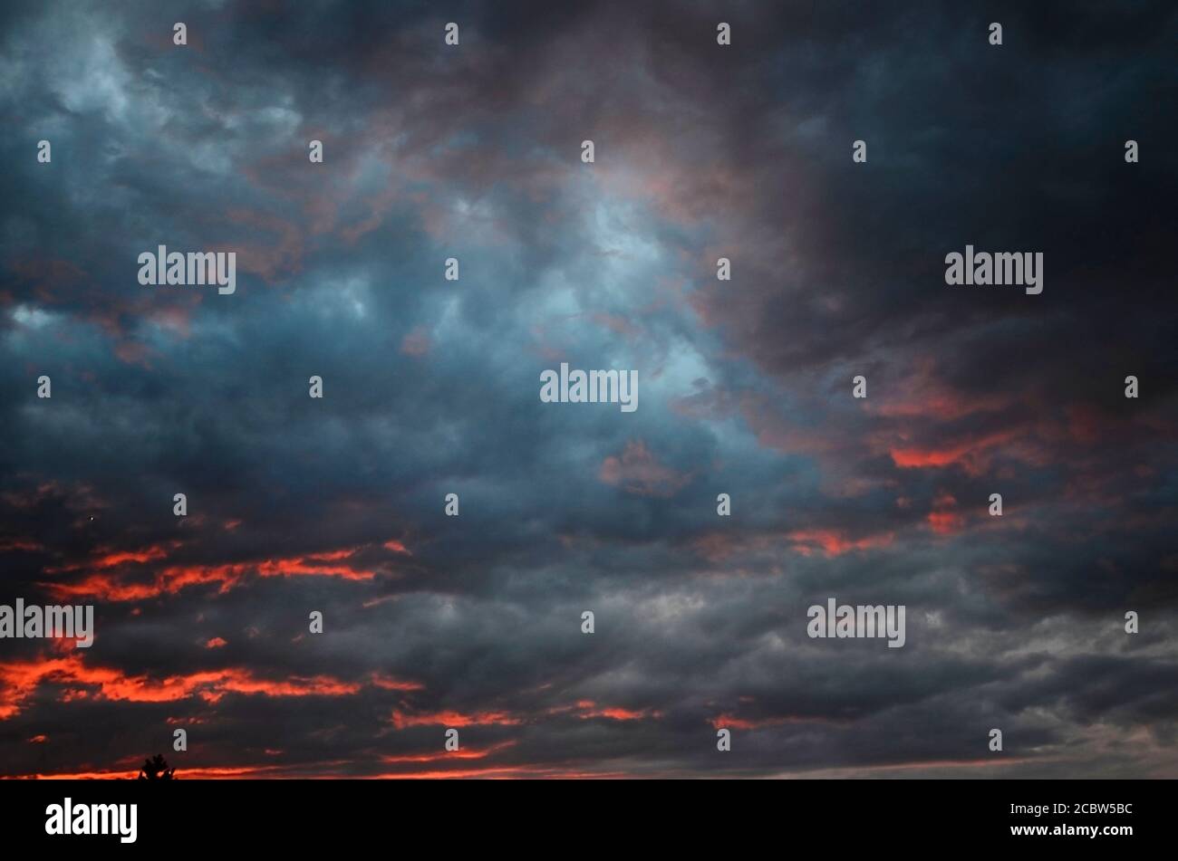 Austria, thunder clouds at sunset Stock Photo - Alamy