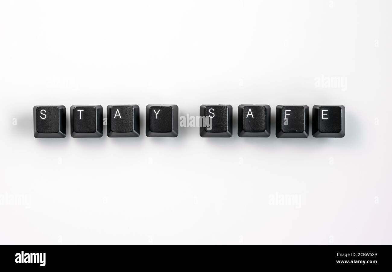 Computer keyboard keys spelling Stay Safe, isolated on white background Stock Photo - Alamy