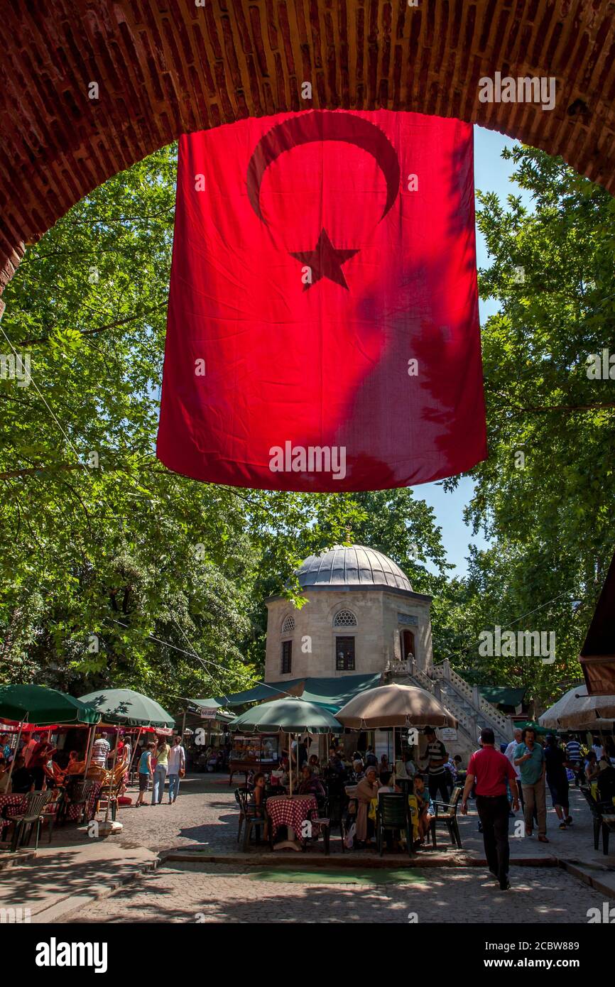 A Turkish flag hangs over the arched entrance to Koza Hani (Cocoon ...