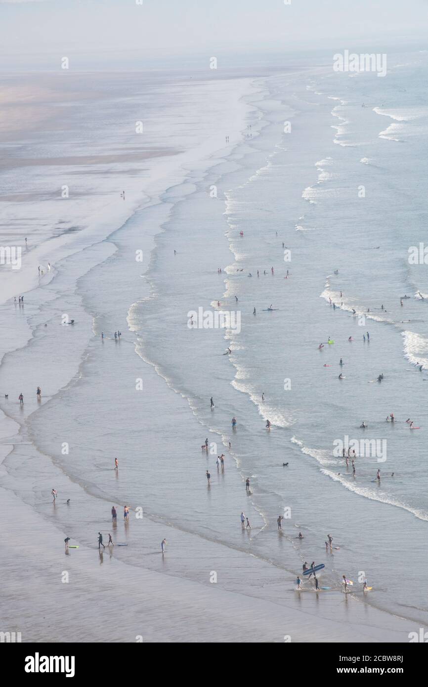 Early morning sea mist on Saunton Sands in North Devon in high summer ...