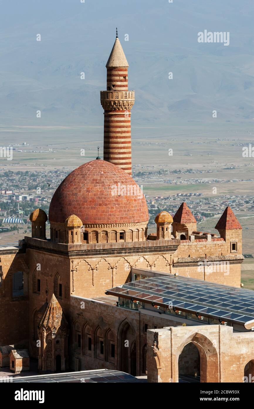 The sun rises over the spectacular dome and minaret of the Ishak Pasa ...