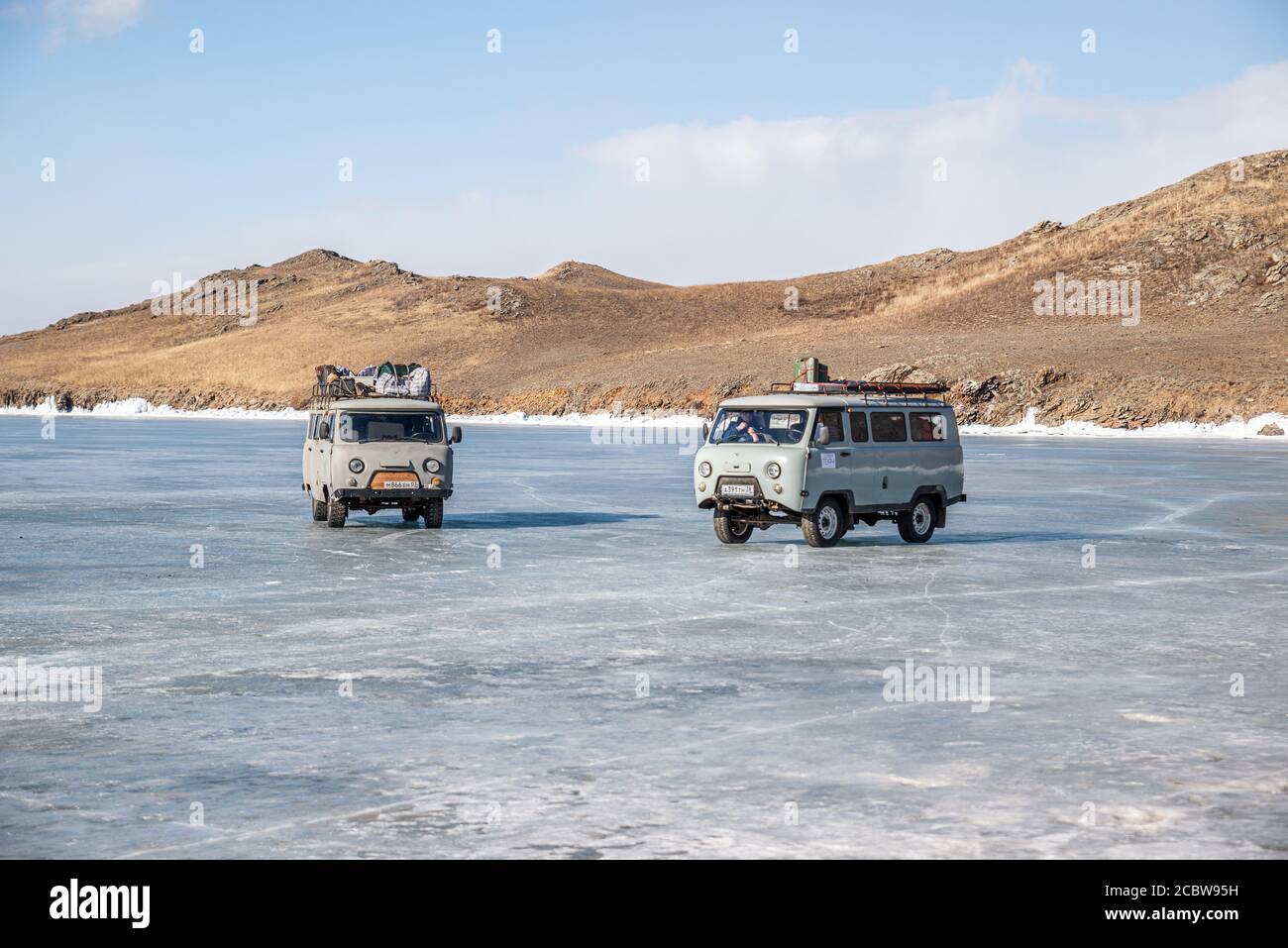 Two UAZ 452 vans on the frozen surface of Lake Baikal, Russia Stock ...