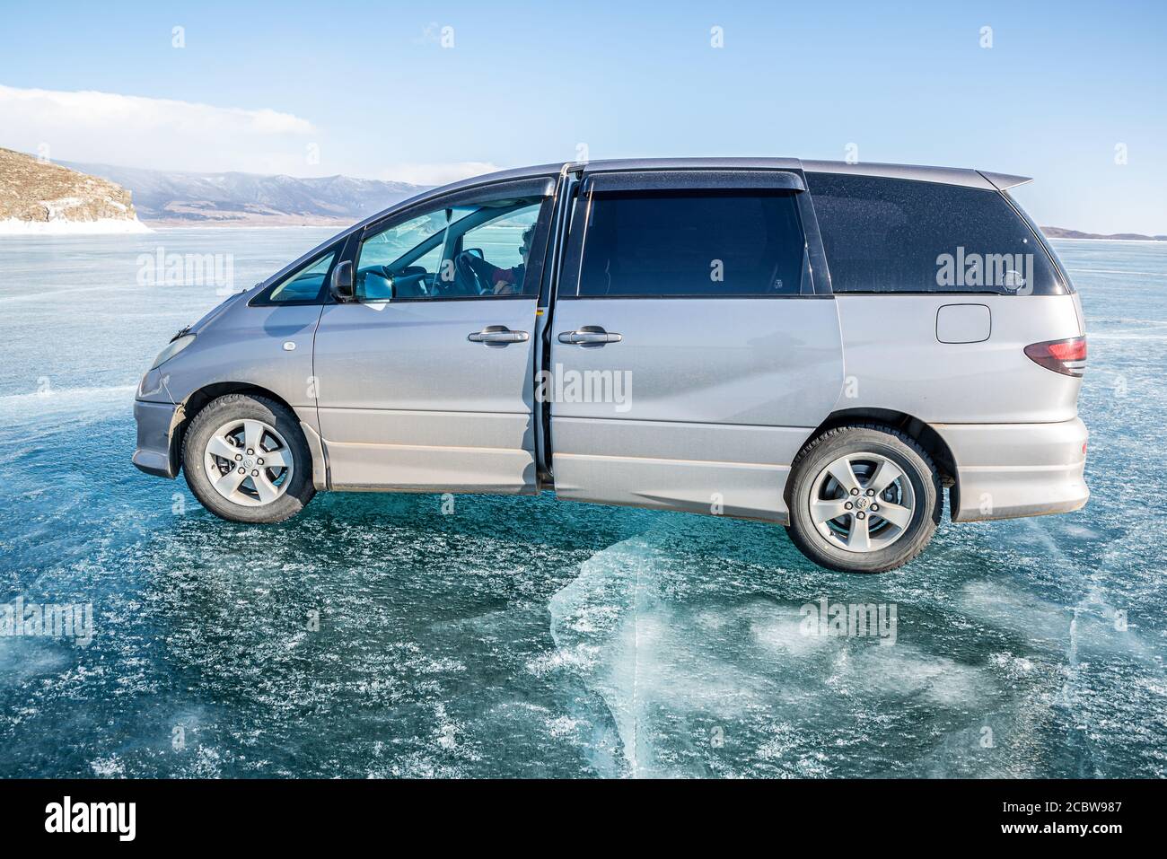 A car on the frozen surface of Lake Baikal, Russia Stock Photo - Alamy