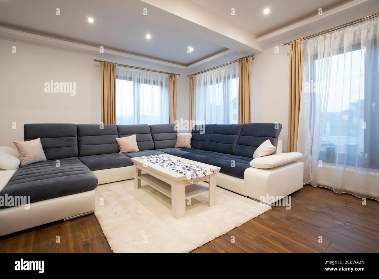 Modern living room interior - wide angle photo Stock Photo - Alamy