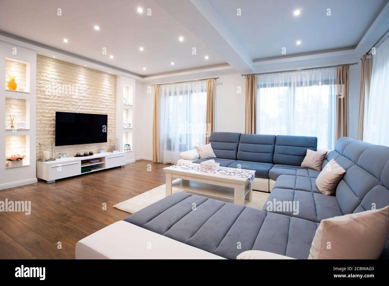 Modern living room interior - wide angle photo Stock Photo - Alamy