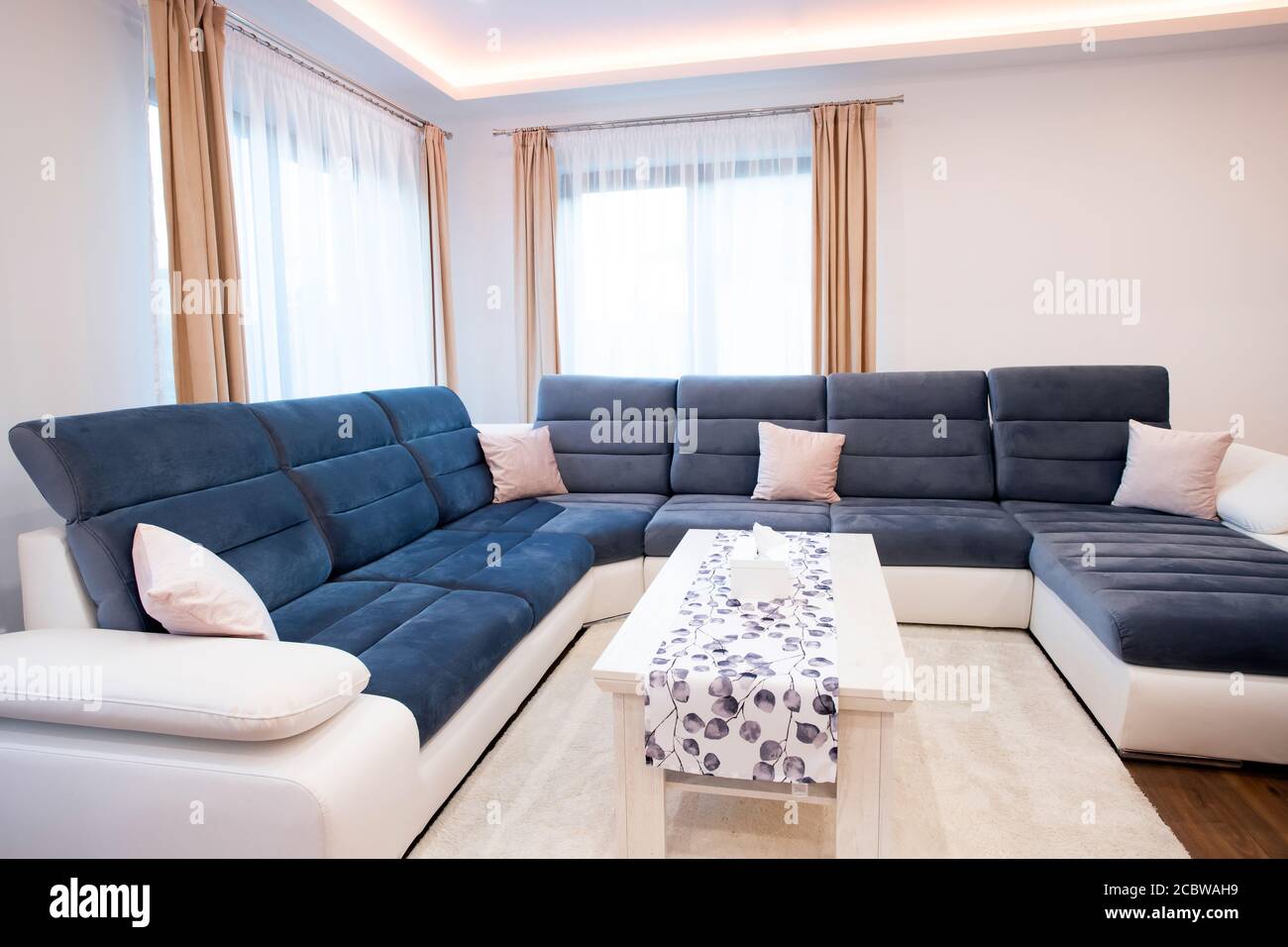 Modern living room interior - wide angle photo Stock Photo - Alamy
