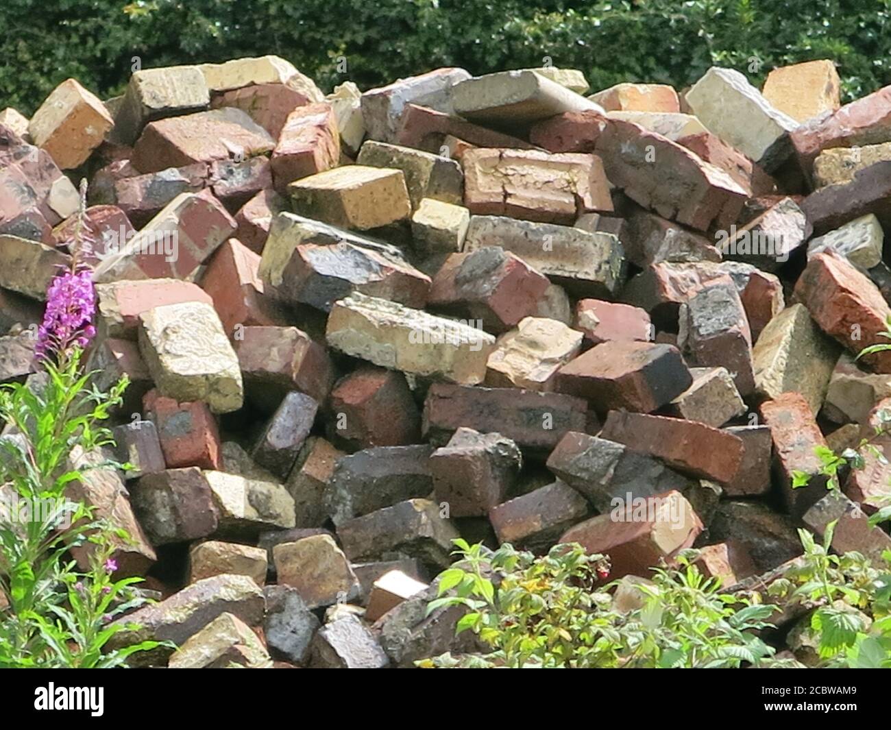 A large heap of bricks left on site after the demolition of a former ...