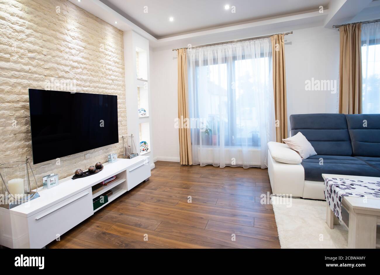 Modern living room interior - wide angle photo Stock Photo - Alamy