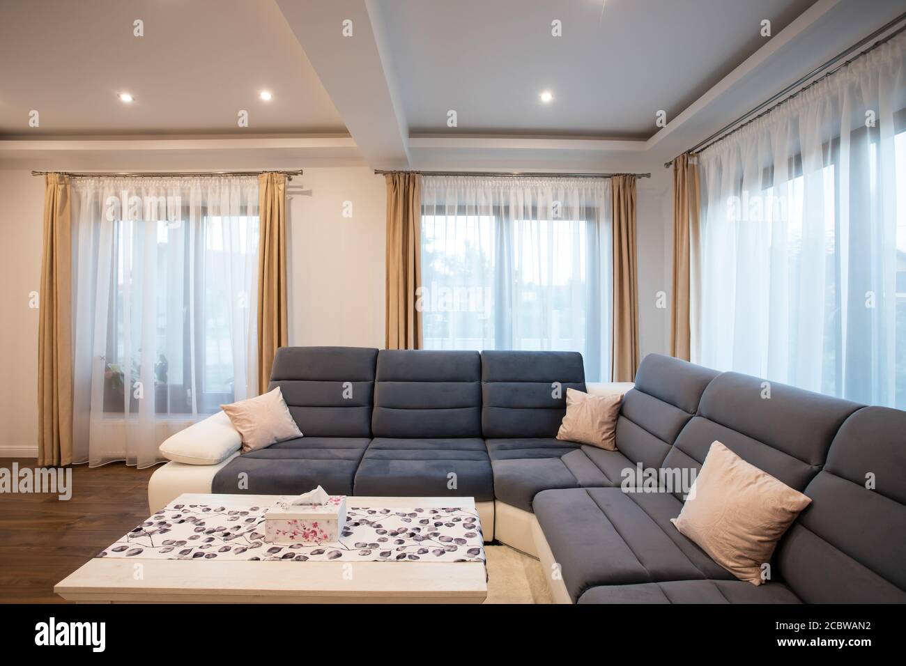 Modern living room interior - wide angle photo Stock Photo - Alamy