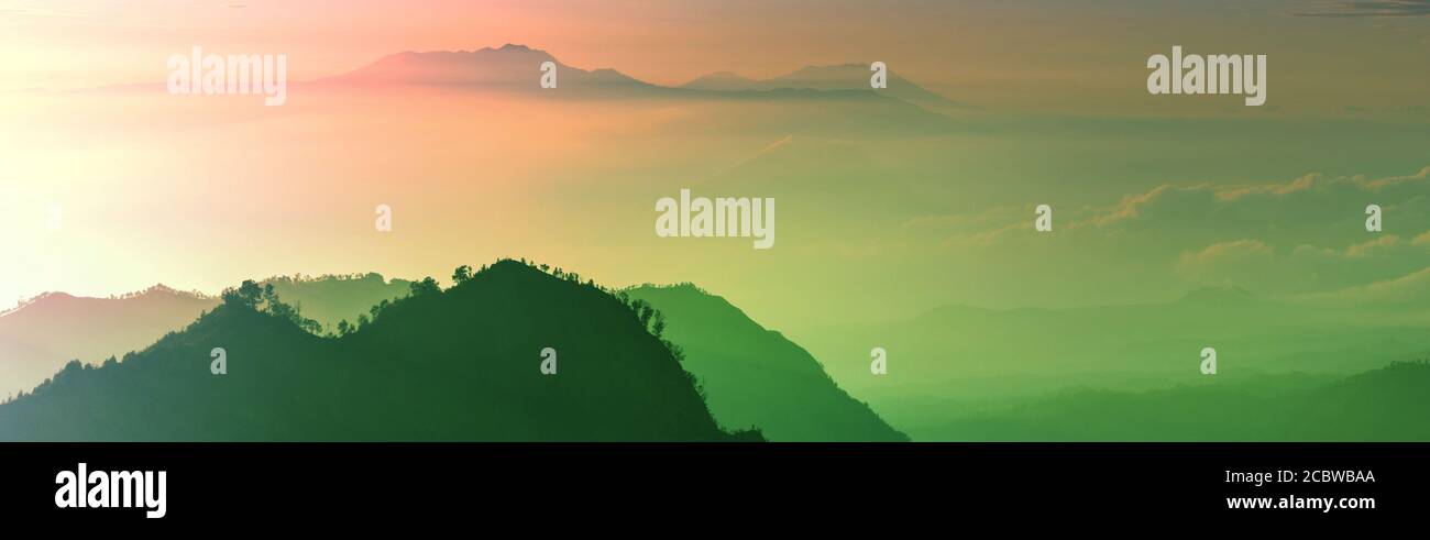 Fabulous light of sun rays at beautiful sunrise in mountains of Java ...