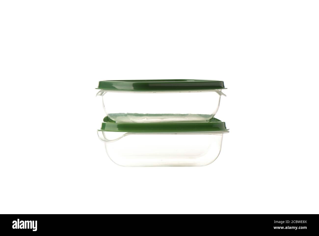 Two Transparent Plastic Containers For Food Isolated On A White Background One Container On Top two-transparent-plastic-containers-for-food-isolated-on-a-white-background-one-container-on-top