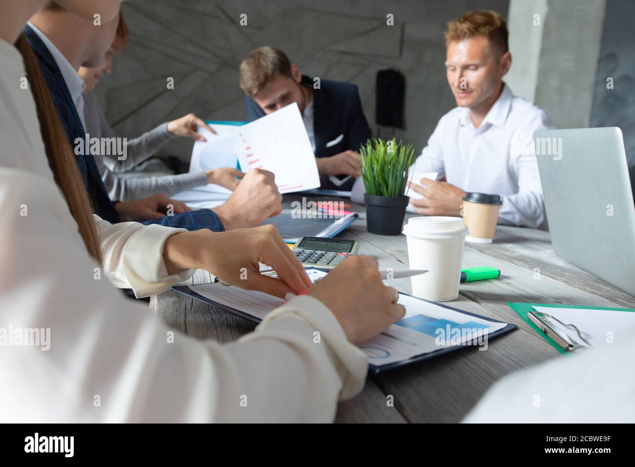 Business people analyzing data diagrams financial reports development ...