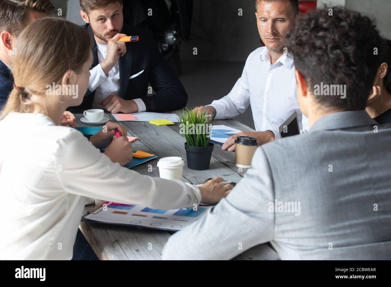 Business people analyzing data diagrams financial reports development ...