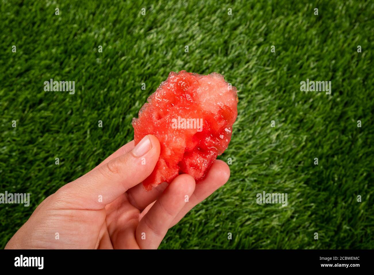 Watermelon in hand hi-res stock photography and images - Alamy