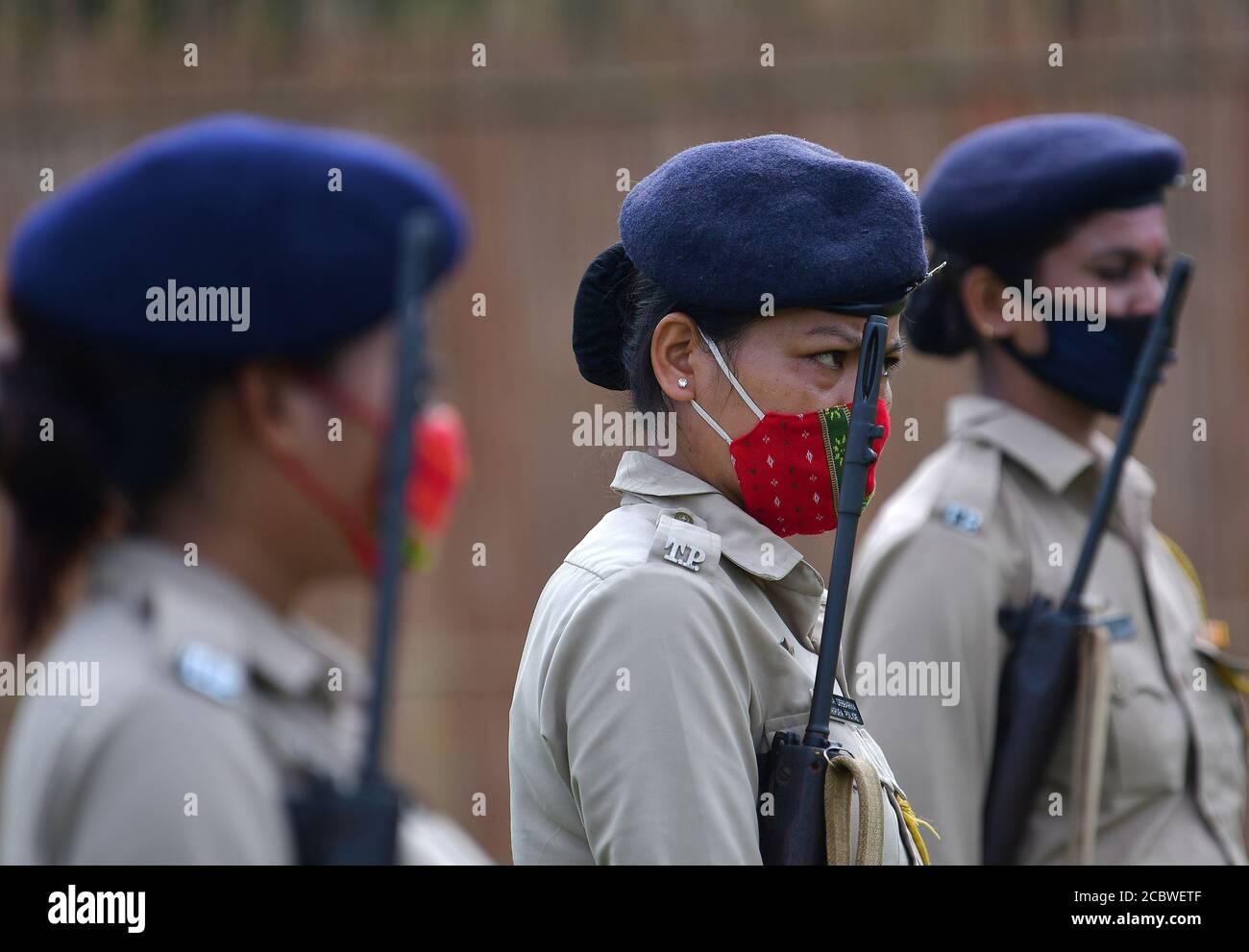 Police personnel wearing face masks take part in a rehearsal ahead of ...