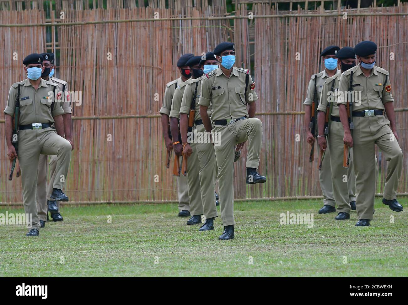 Police personnel wearing face masks take part in a rehearsal ahead of ...