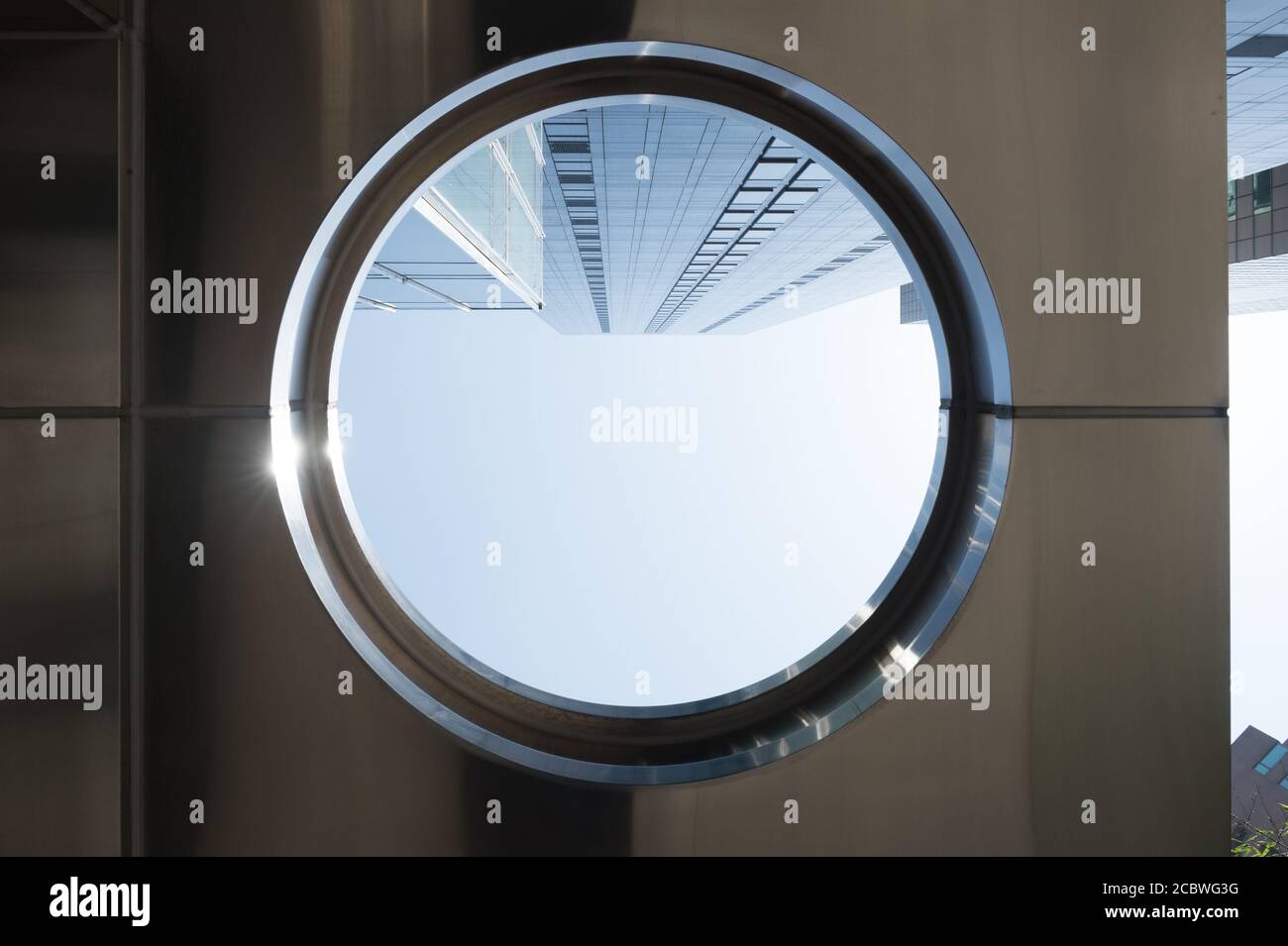 Circle windows with modern buildings in the city Stock Photo - Alamy