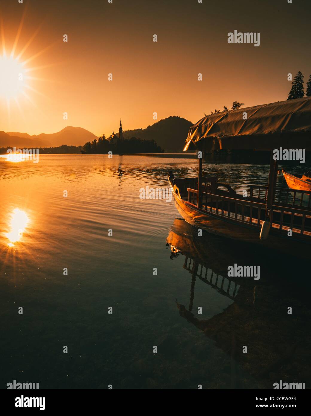 boats at lake bled slovenia during summer sunset - holiday landscape ...