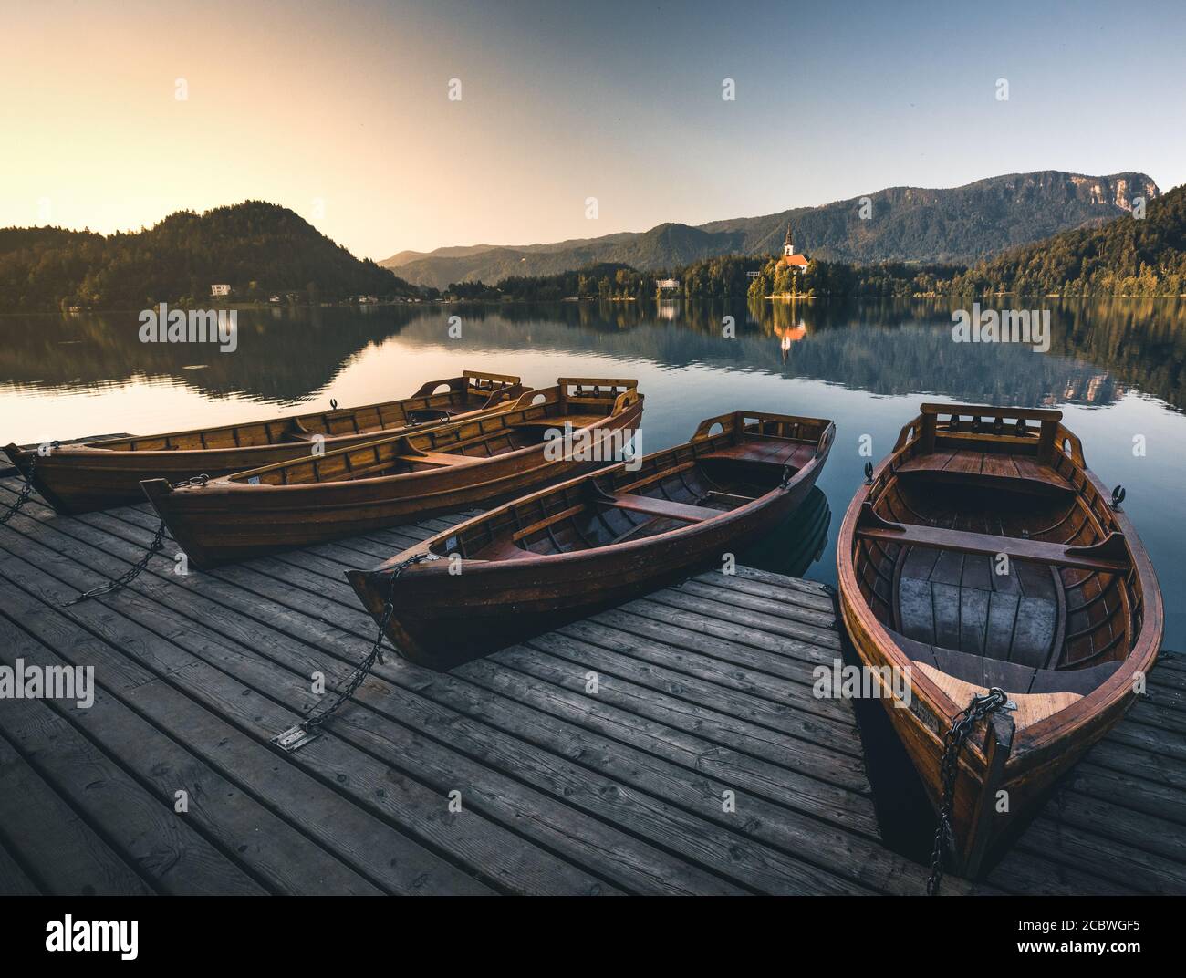 boats at lake bled slovenia during summer sunset - holiday landscape ...