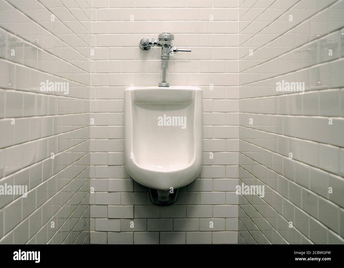 Urinal in mens restroom Stock Photo - Alamy