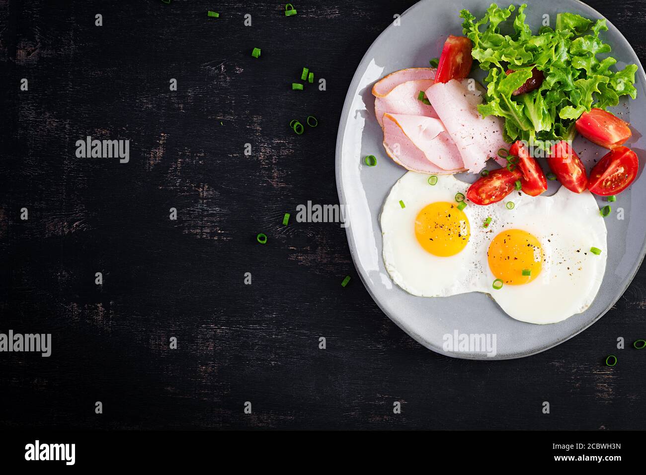 Ketogenic/paleo diet. Fried eggs, ham and fresh salad. Keto breakfast ...