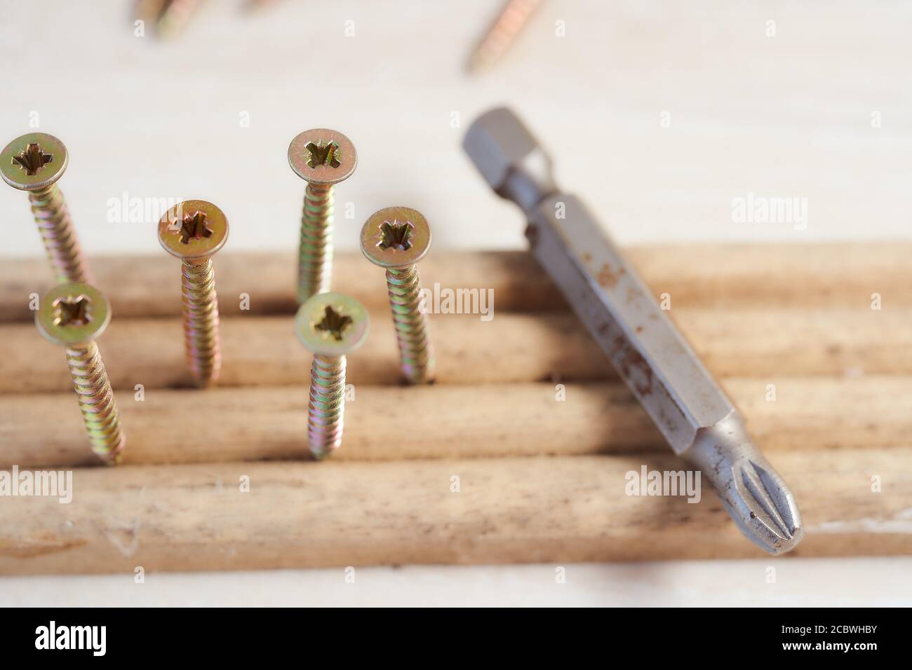 Golden screws construction board hi-res stock photography and images ...