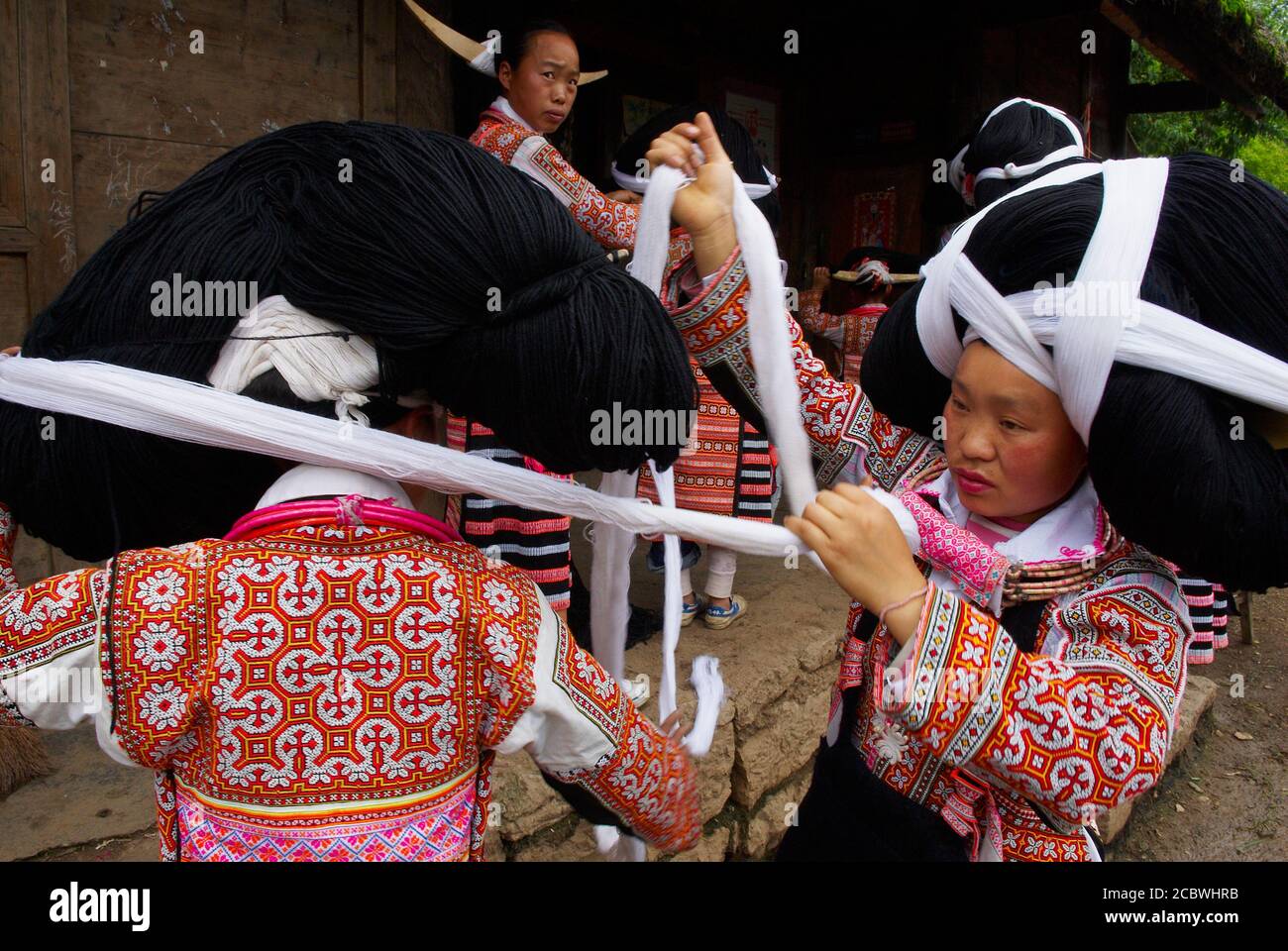 China. Guizhou province. Longjia village. Long Horn Miao girls in ...