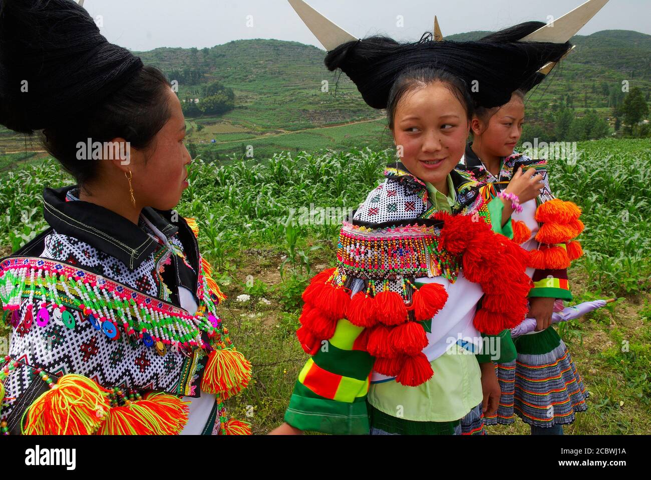 China. Guizhou province. Around Zhijian. Long Horn Miao girls in ...