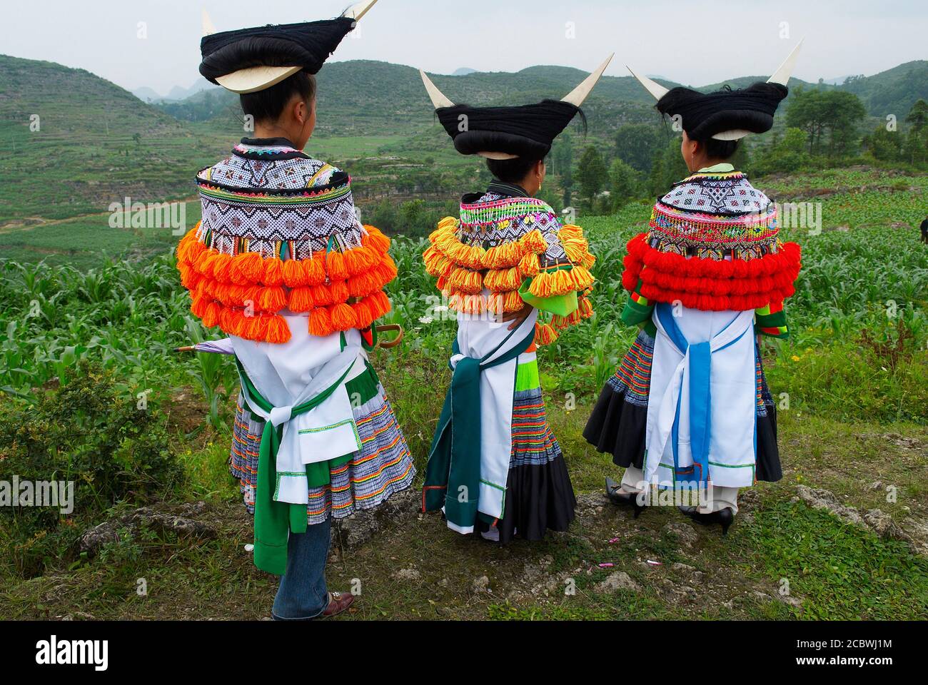 China. Guizhou province. Around Zhijian. Long Horn Miao girls in ...