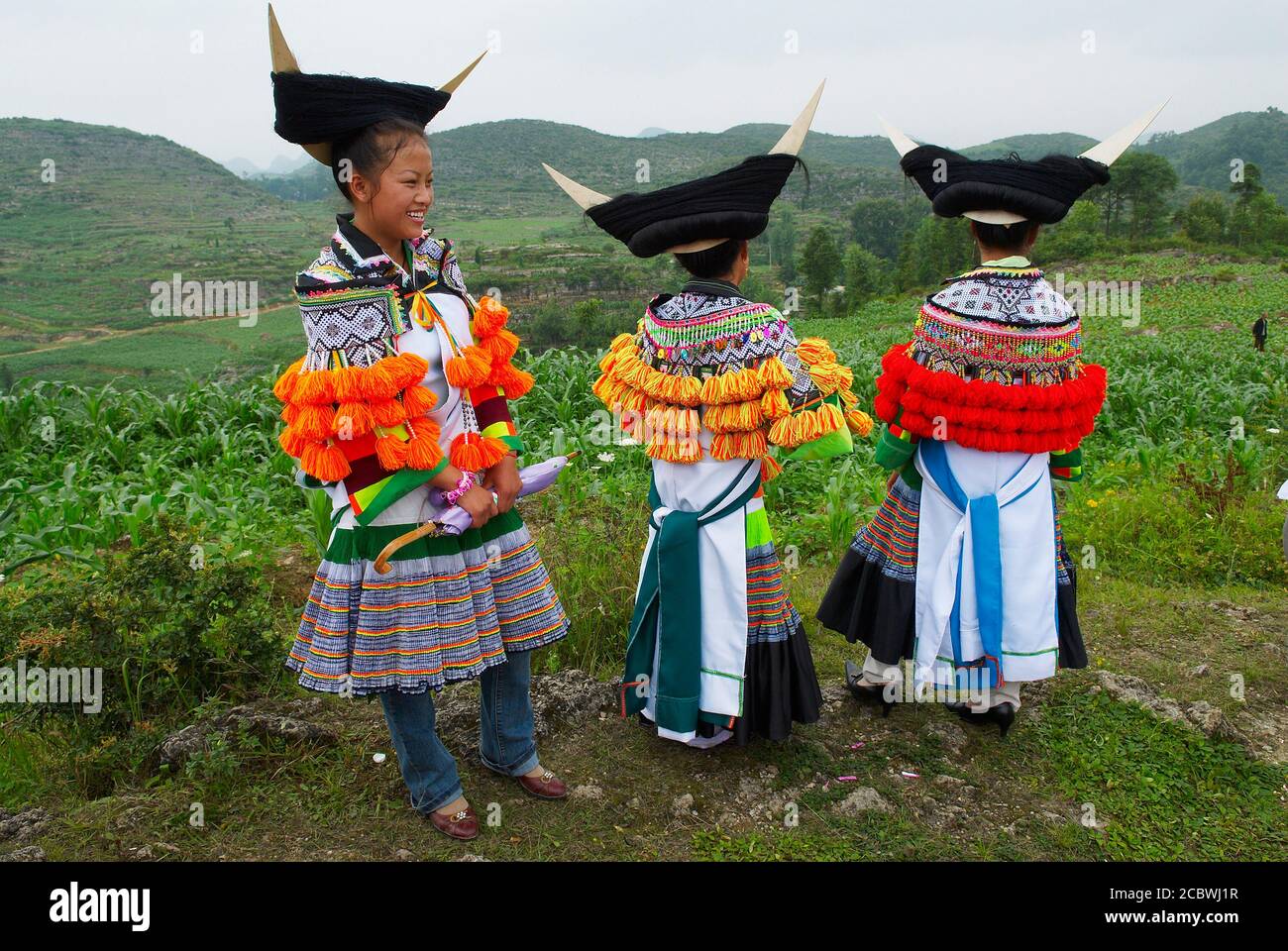 China. Guizhou province. Around Zhijian. Long Horn Miao girls in ...