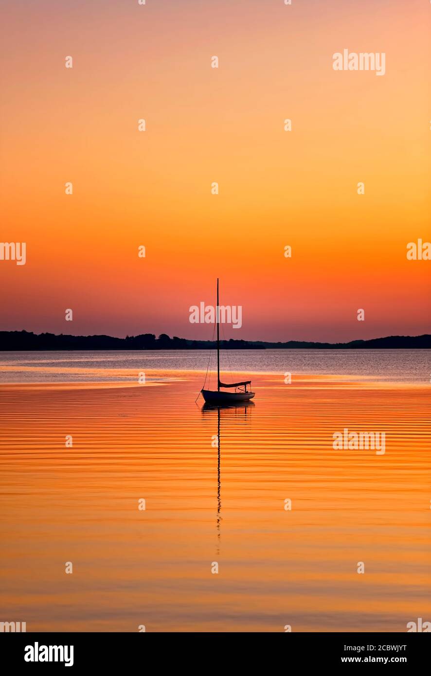 Sailboat at sunset, Cape Cod, Massachusetts, USA Stock Photo - Alamy