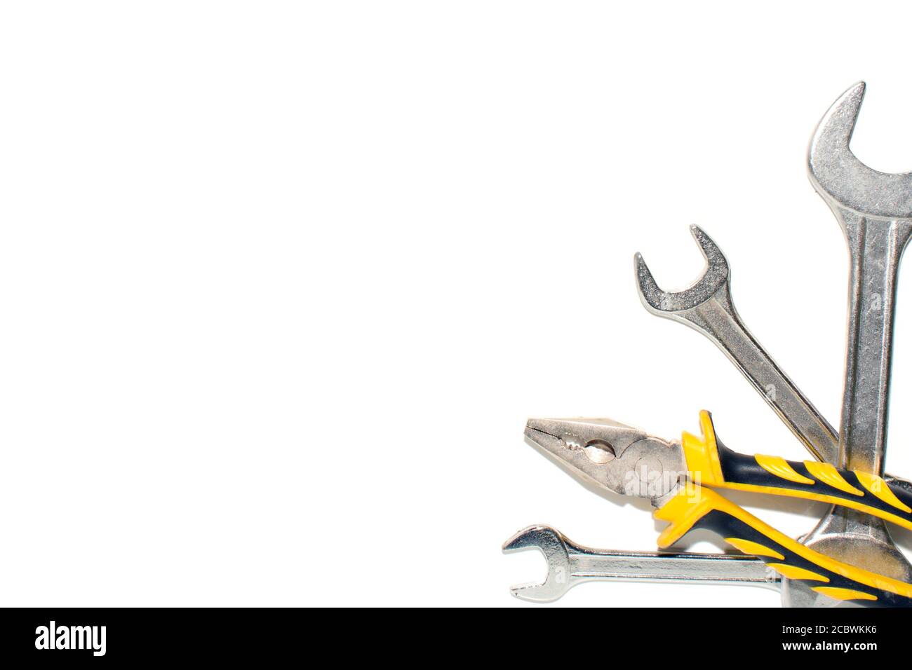 Brilliant keys and pliers on a white background Stock Photo - Alamy