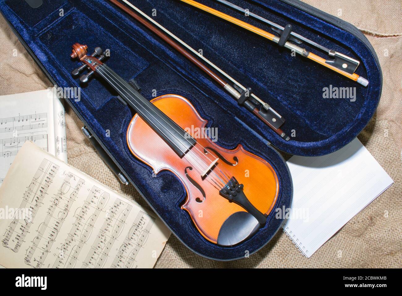 Violin neck on music papers background Stock Photo - Alamy