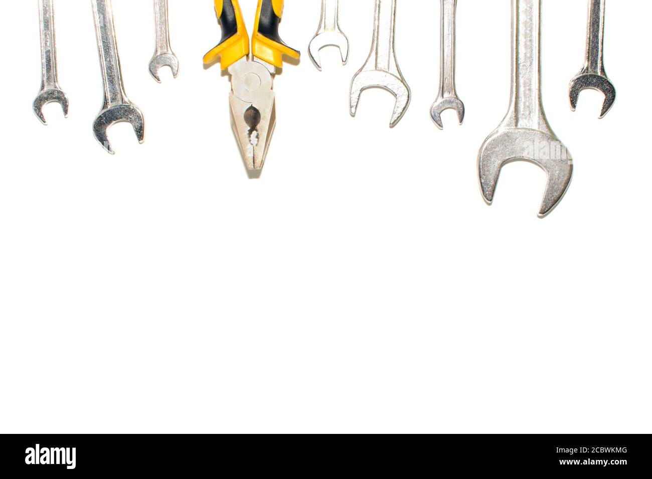 Brilliant keys and pliers on a white background Stock Photo - Alamy