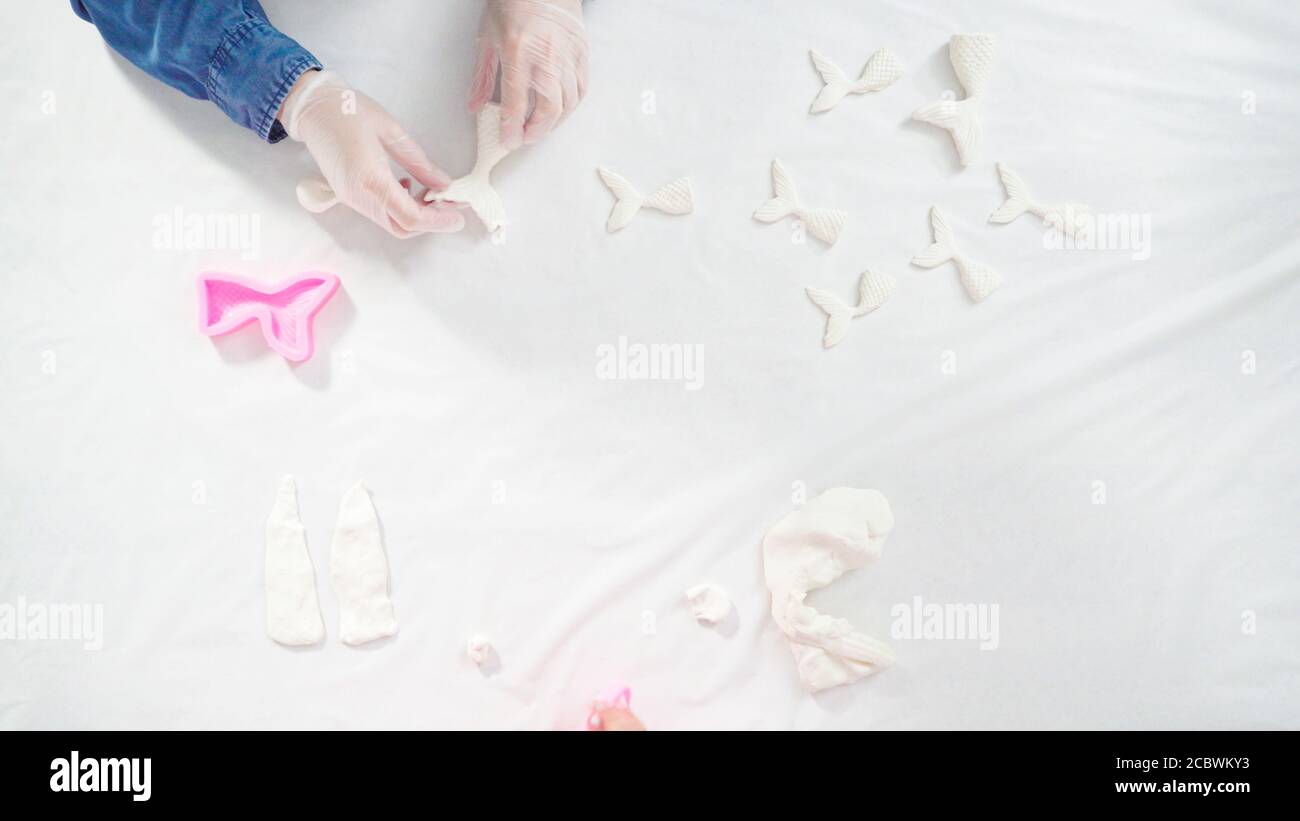Flat lay. Step by step. Making mermaid tail from modeling clay in ...