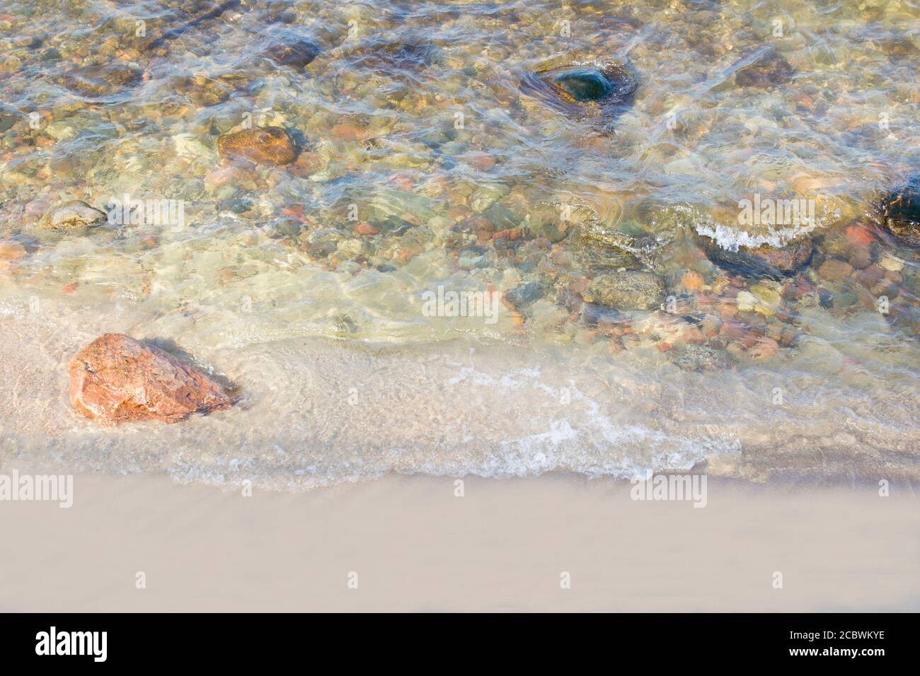 Soft Wave Of Ocean On Sandy Beach. Background. Selective focus Stock ...