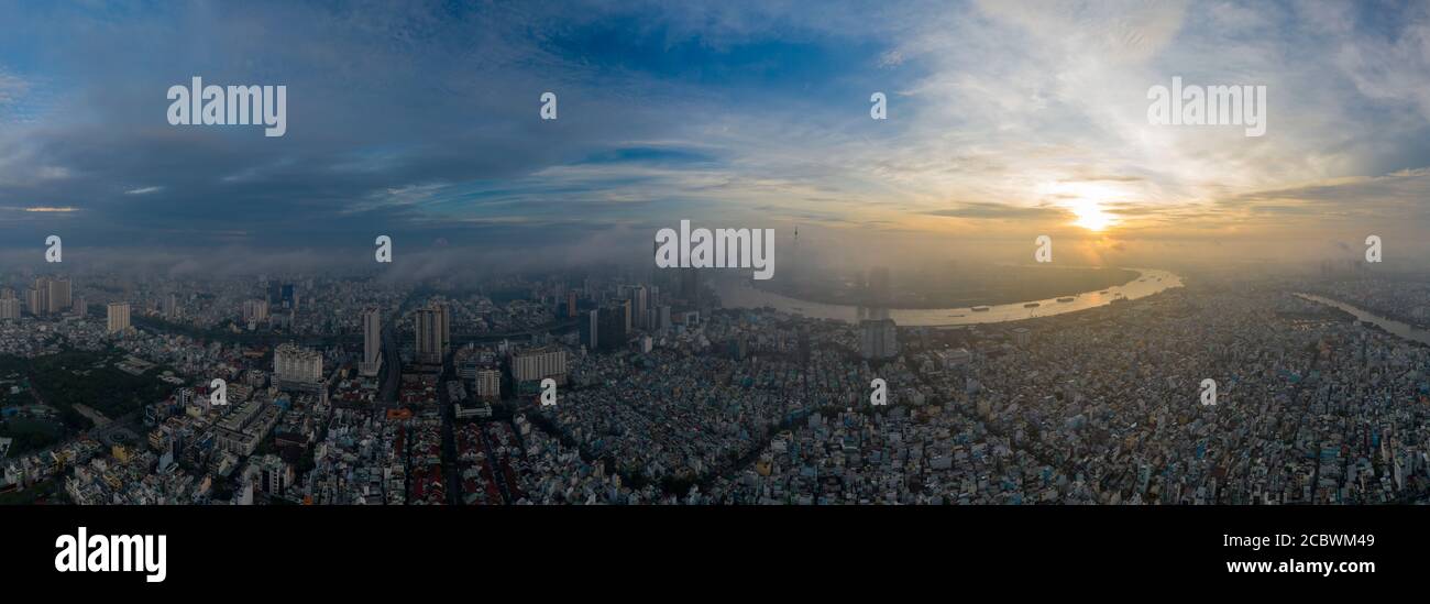 Aerial panorama of colorful sunrise and morning fog in Ho Chi Minh City ...