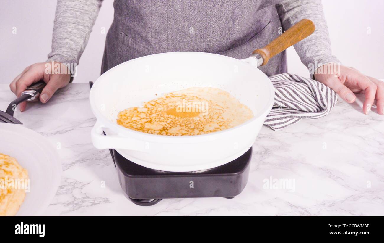 Making crepes in a small frying pan over medium heat Stock Photo - Alamy